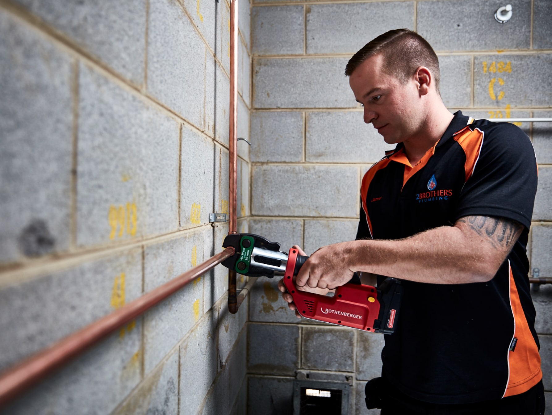 Romax tool in hand used on copper piping